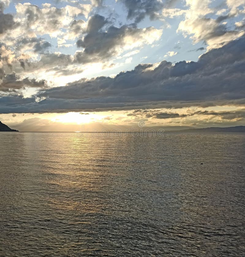 Sun Rays in the Sunset Over the Lake Stock Photo - Image of people ...