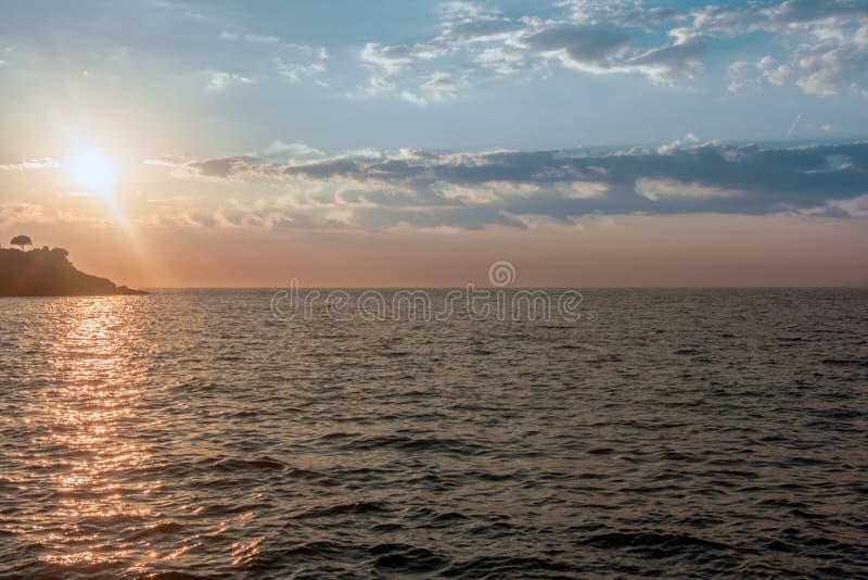 Sun Rays Sunset Reflected in the Sea and Sky Stock Photo - Image of ...
