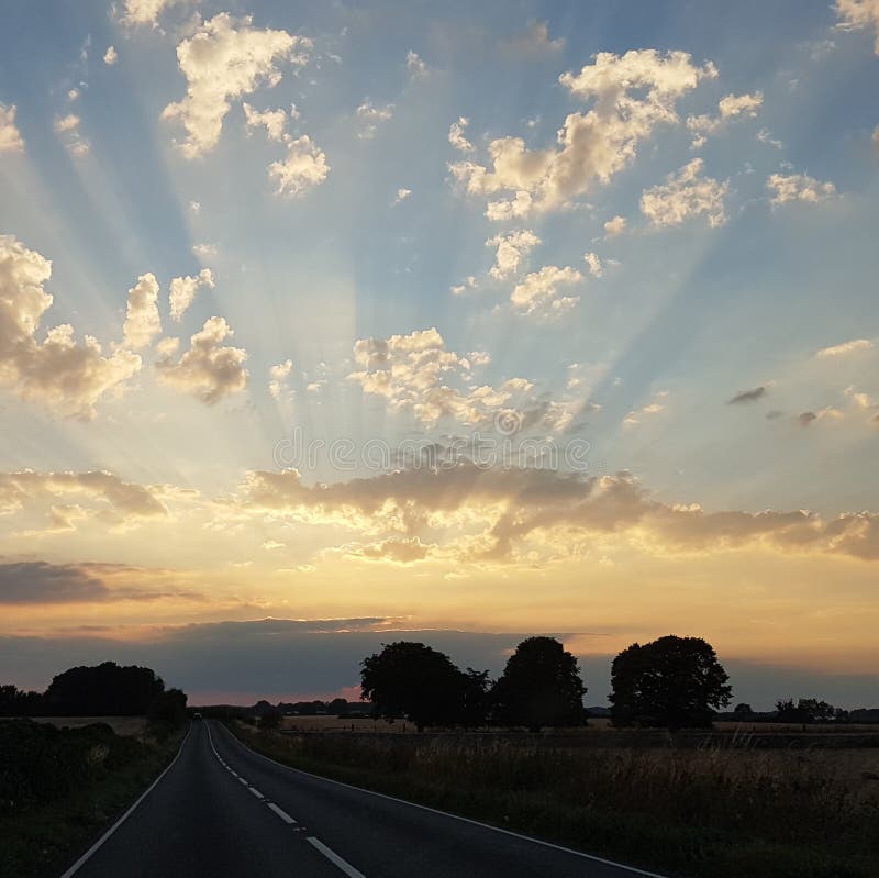 Sun rays in a sunset sky stock photo. Image of wowza - 123653652
