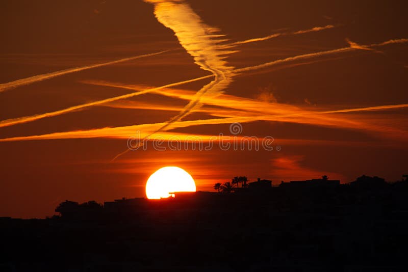 The sun in a red sky stock image. Image of orange, palm - 194356859