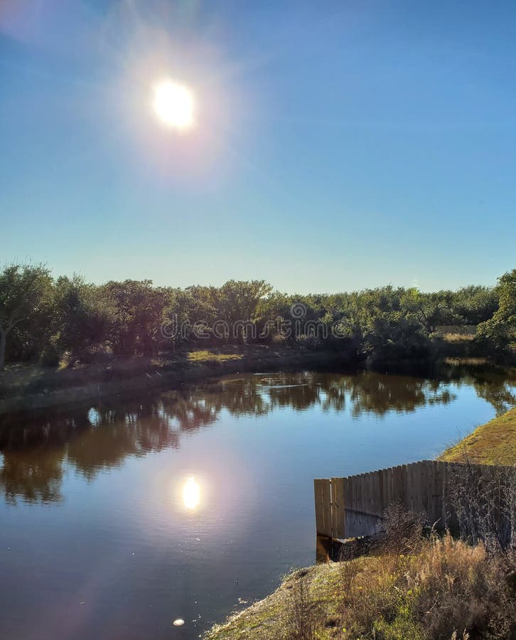 Sun Reflecting on Water Lake Pond Stock Image - Image of water, lake ...