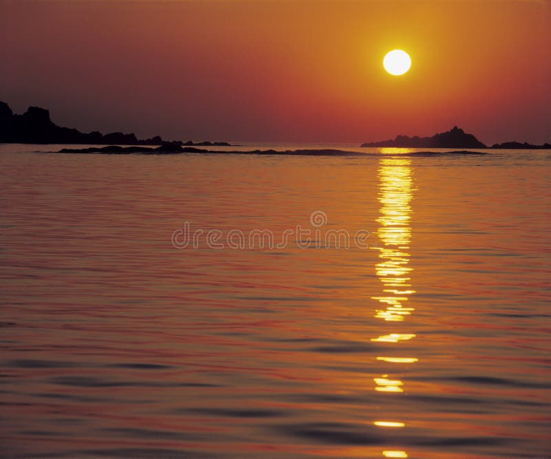 Sun Reflecting on Water at Sunset Stock Photo - Image of idyllic, quiet ...