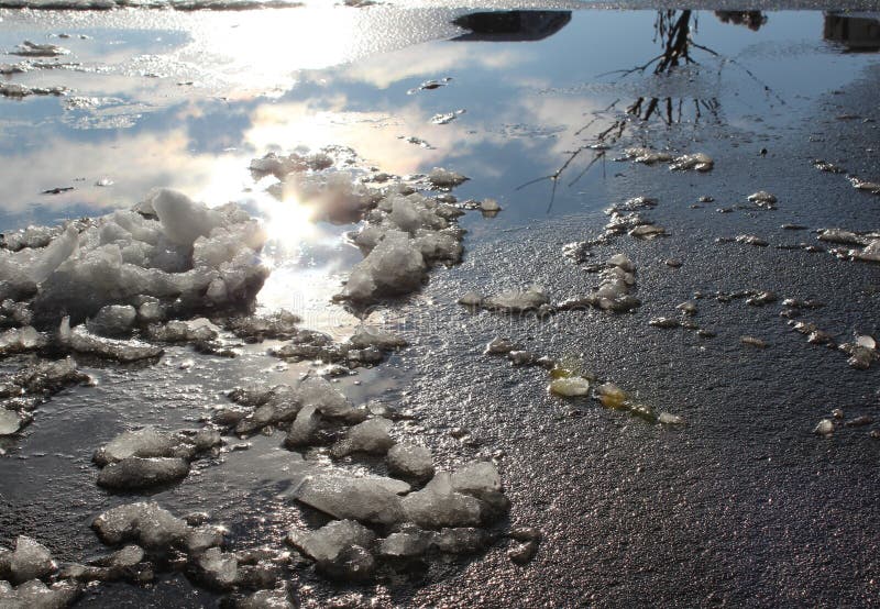 Sun reflection in a puddle stock photo. Image of road - 206952542