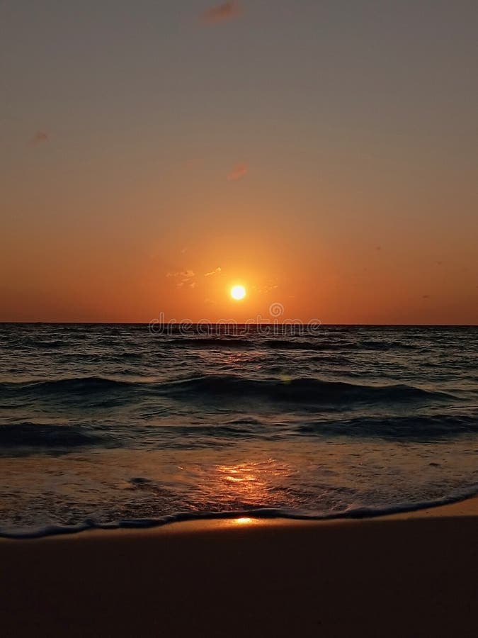 The Sun Rises on the Beach and Refracts Its Golden Light. Stock Image ...