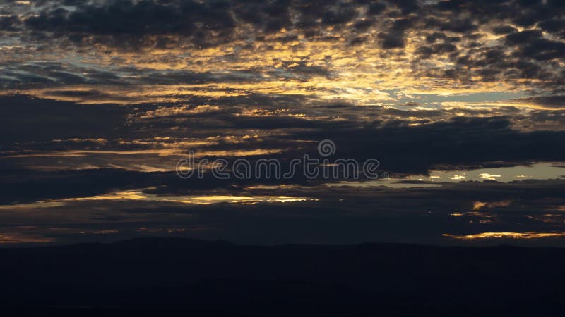 Sun Rises Behind Mostly Cloudy Sky Zoom in Timelapse Stock Footage ...