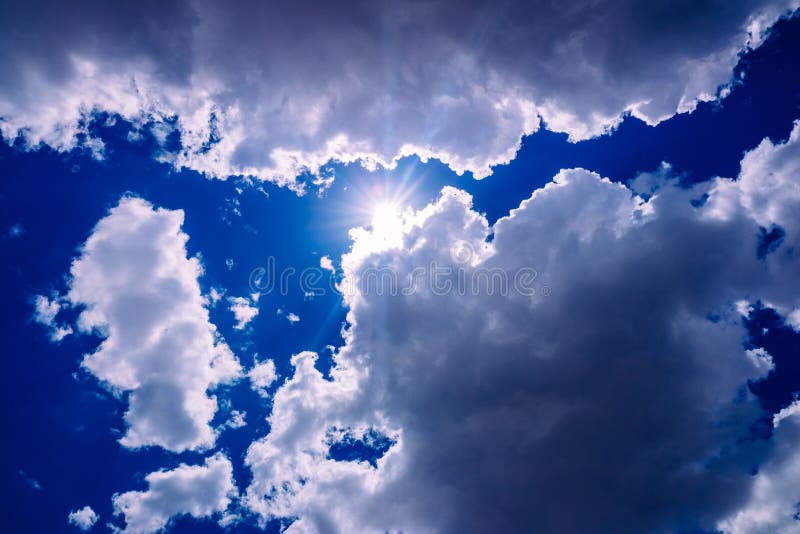 The Sun Rises between Divine-inspired Bluish Storm Clouds Stock Image ...