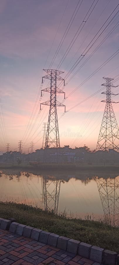 The Sun Rises between the High Voltage Cables Stock Photo - Image of ...