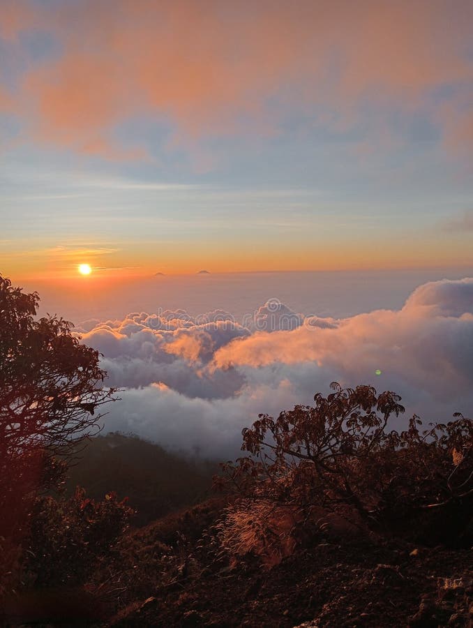 The Sun Rises on the Mountain with a Sea of Clouds Stock Image - Image ...