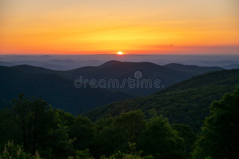 Sun Rises Over Horizon Behind Shenandoah Mountains Stock Photo - Image ...