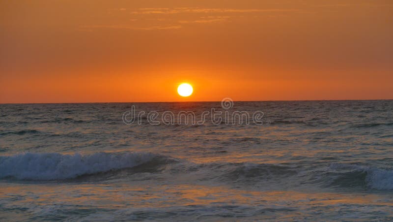 The sun rises over the sea stock image. Image of abstract - 96560417
