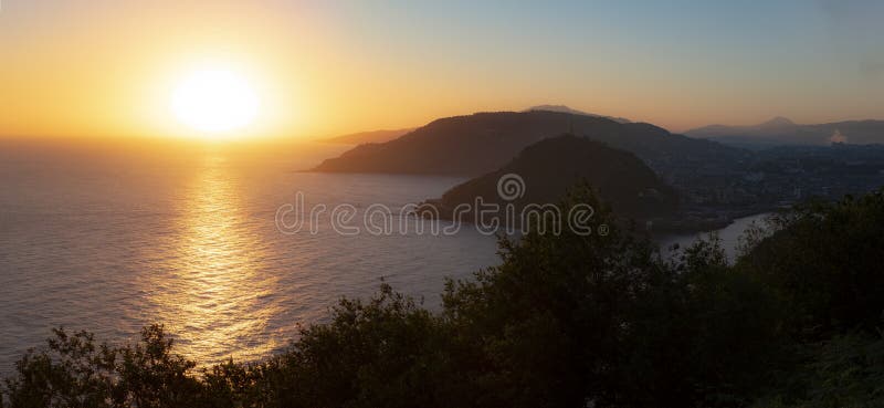 The sun rises in the sea stock image. Image of gipuzkoa - 119701317