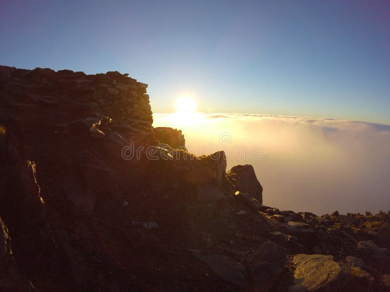 Sun Rising Above the Clouds Stock Photo - Image of mountain, mount ...