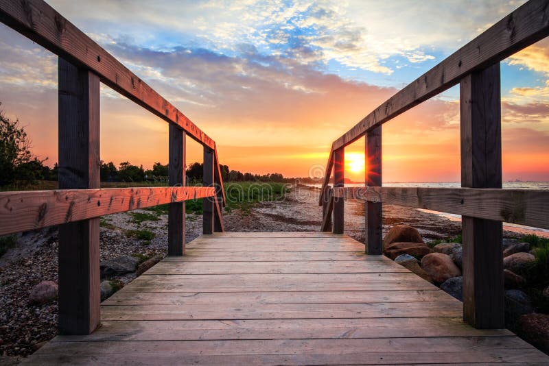Sun Rising at Beach on Bridge Stock Photo - Image of stone, evening ...