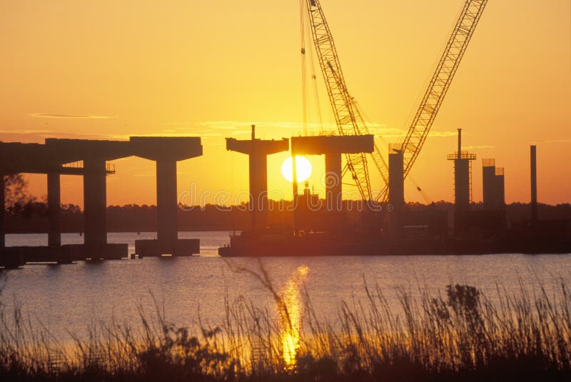 A Sun Rising Behind a Bridge Building Site Stock Image - Image of ...