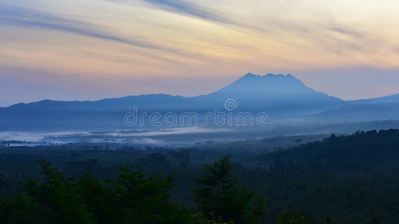Sun Rising Behind the Mountains in East Java Stock Photo - Image of ...