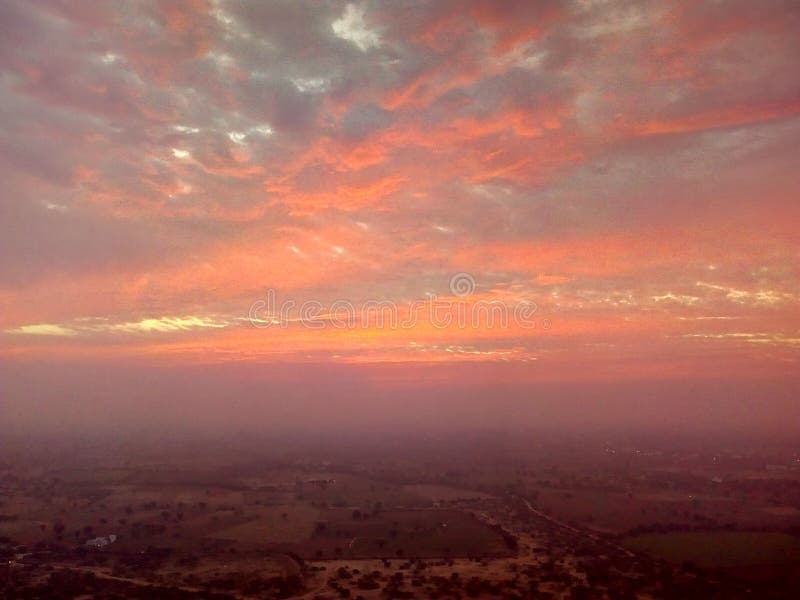 The Sun Rising Behind Red Clouds Stock Image - Image of plain, horizon ...