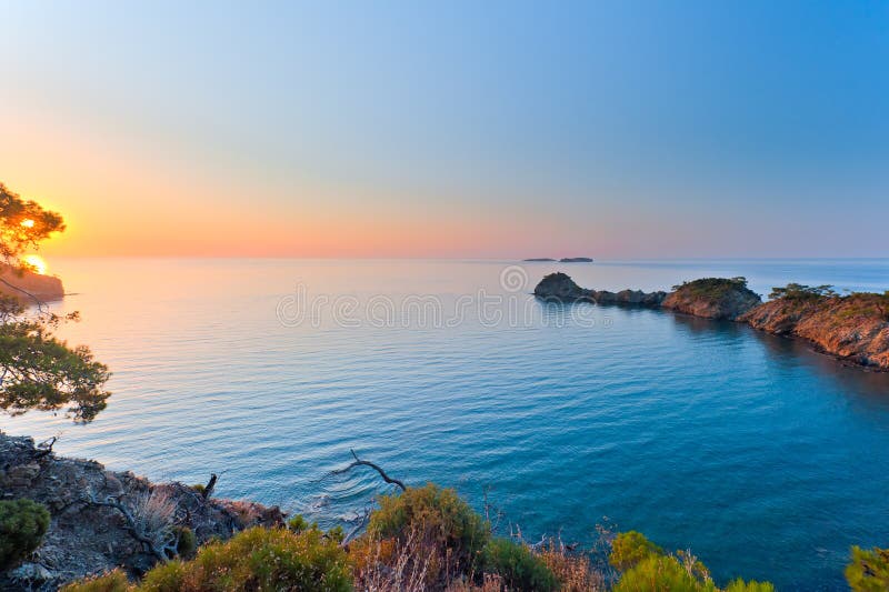 Sun Rising Over a Calm Sea in the Bay Stock Photo - Image of scene ...