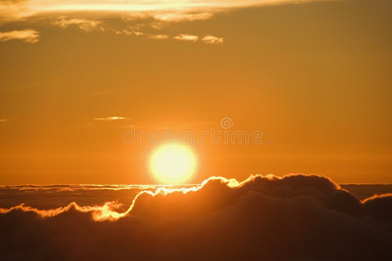 Sun rising over clouds. stock photo. Image of sunrise - 2045218
