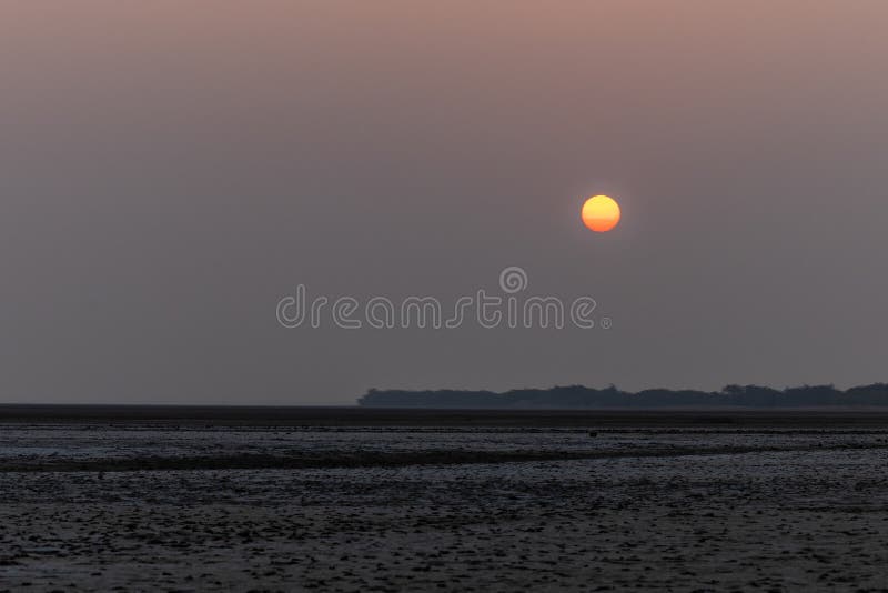 Sun Rising Over Farm Fields with Bright Orange Sky at Morning Stock ...