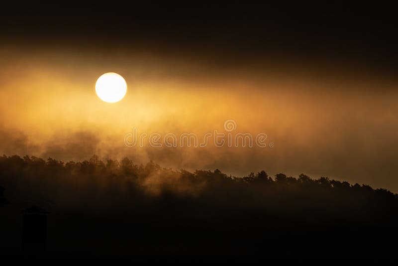 Sun Rising Over a Forest on a Cold Day.. Stock Photo - Image of ...
