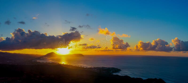 Sun rising over Hawaii stock photo. Image of clouds - 137930928