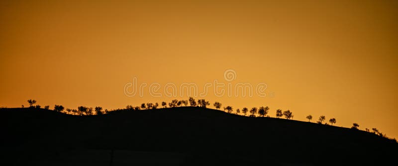 The Sun Rising Over the Horizon of the Mountains. Stock Photo - Image ...