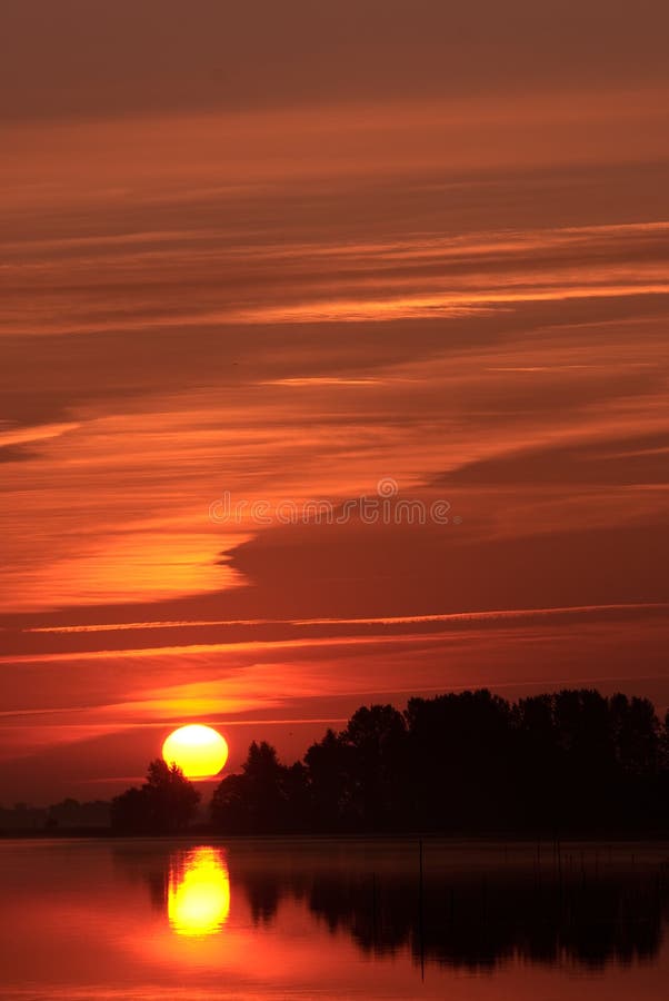 Sun rising over lake stock photo. Image of sunrise, nature - 7970350