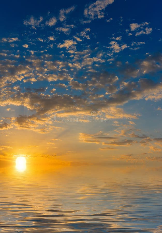 Sun Rising Over the Sea and Clouds Stock Photo - Image of romantic ...