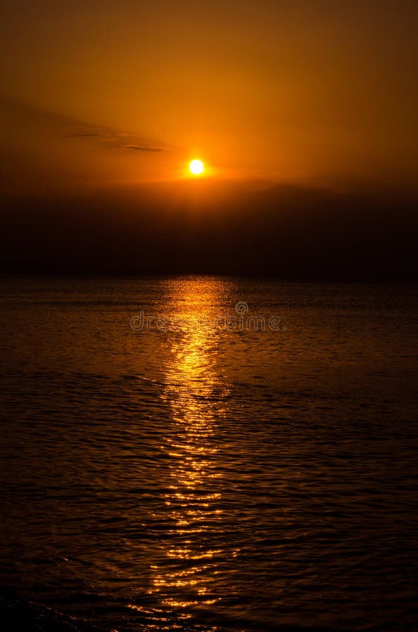 Sun rising stock photo. Image of clouds, seaside, rays - 31882924