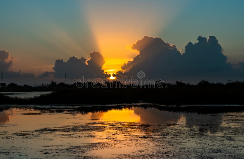 Sunrise Over a Pond with Reflection of Clouds and Telephone Wires in ...