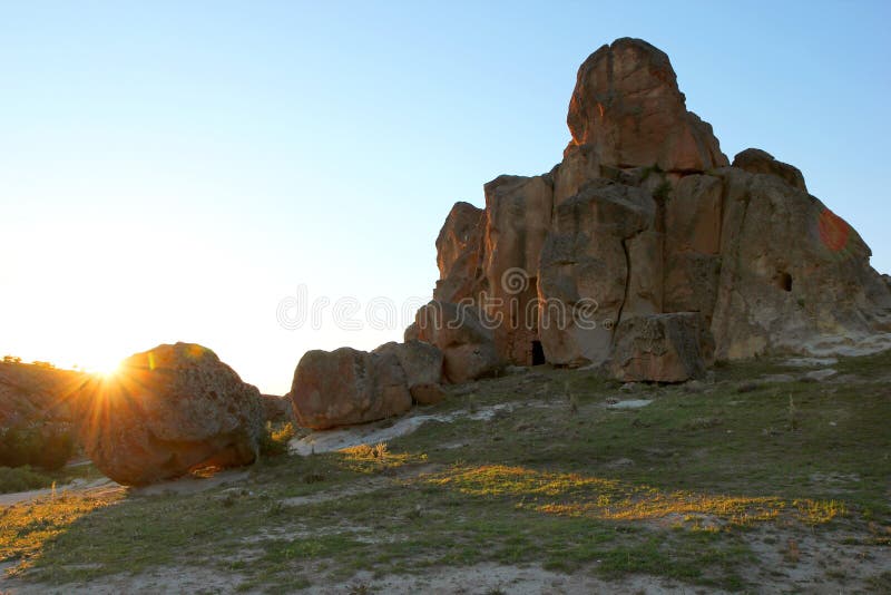 Sun and rock stock photo. Image of orange, travel, green - 53032550