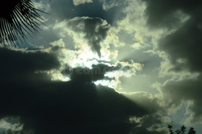 Sun S Rays are Breaking through Behind the Clouds Stock Photo - Image ...