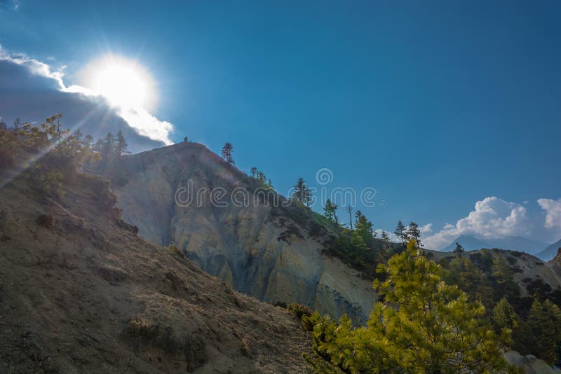 The Sun`s Rays Illuminate the Slopes of the Himalayan Mountains. Stock ...