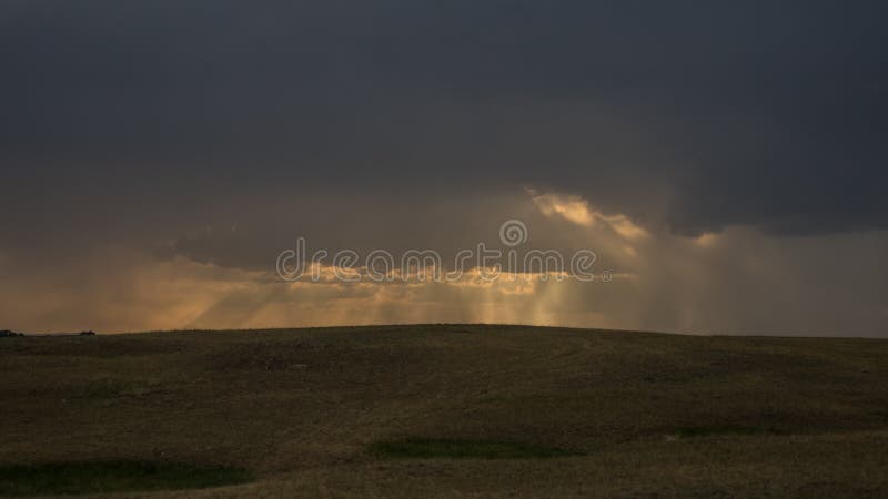 The Sun S Rays Pass through the Clouds during Sunset in the Steppe ...