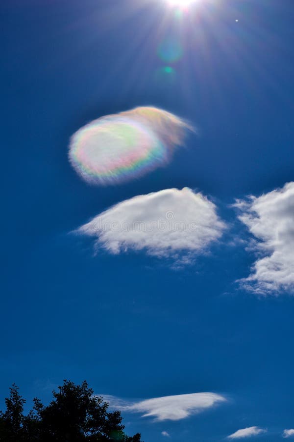 Sun`s Rays are Refracted in the Cloud. Rainbow in the Cloud. Stock ...