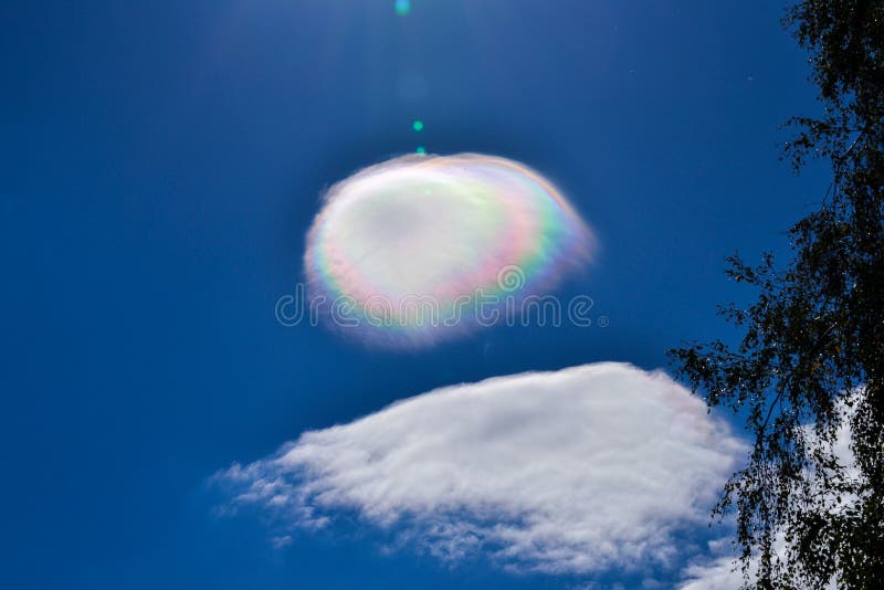 Sun`s Rays are Refracted in the Cloud. Rainbow in the Cloud. Stock ...