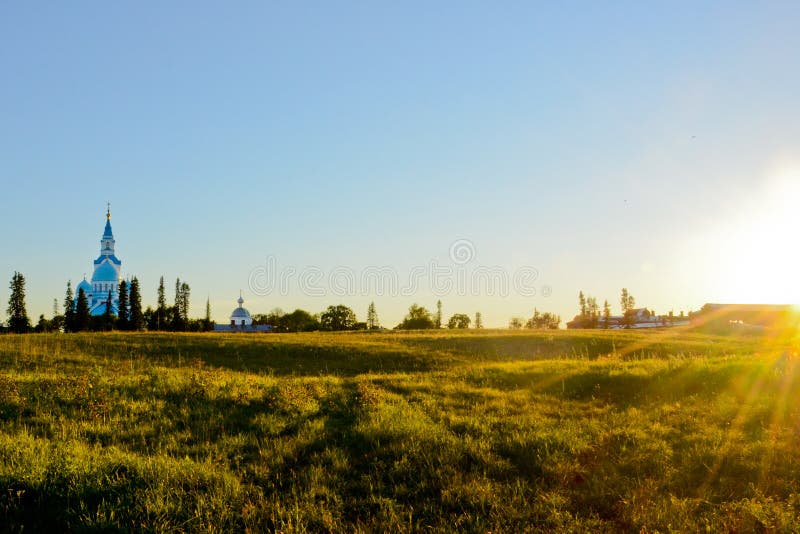 The Sun`s Rays of Setting Sun Over Green Field on the Island of Valaam ...