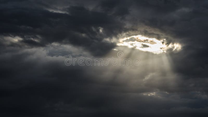 The Sun`s Rays Shine through a Hole in the Continuous Cloud Cover Stock ...