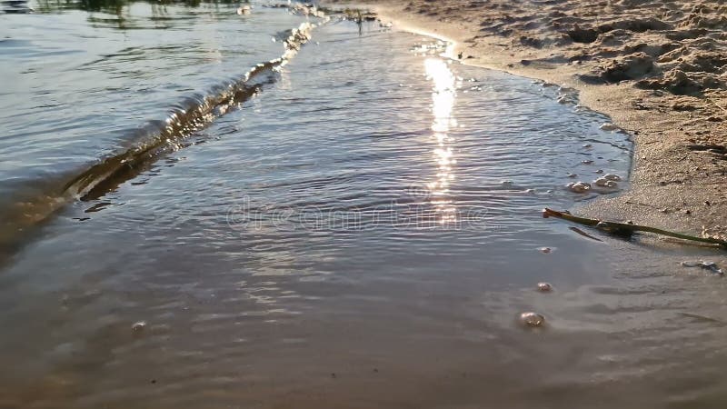 The Sun S Reflection in the Water. Sandy Beach with Waves Stock Video ...