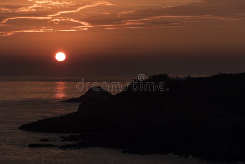 Sun set over the ocean stock photo. Image of line, ocean - 133563764