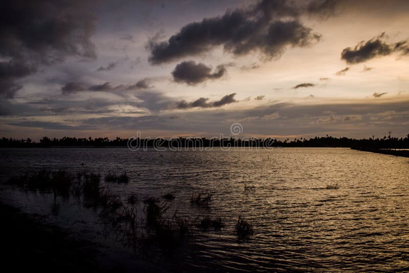 Sun Set Sky with Grey Clouds and Beautiful Sky Over a Lake Stock Photo ...