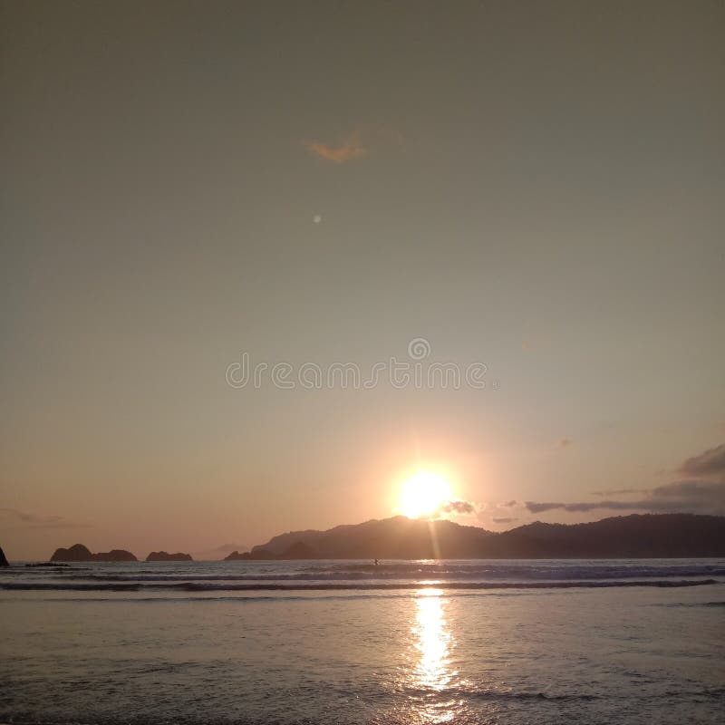 The Sun Sets on the Beach with a Cool Breeze Stock Photo - Image of ...
