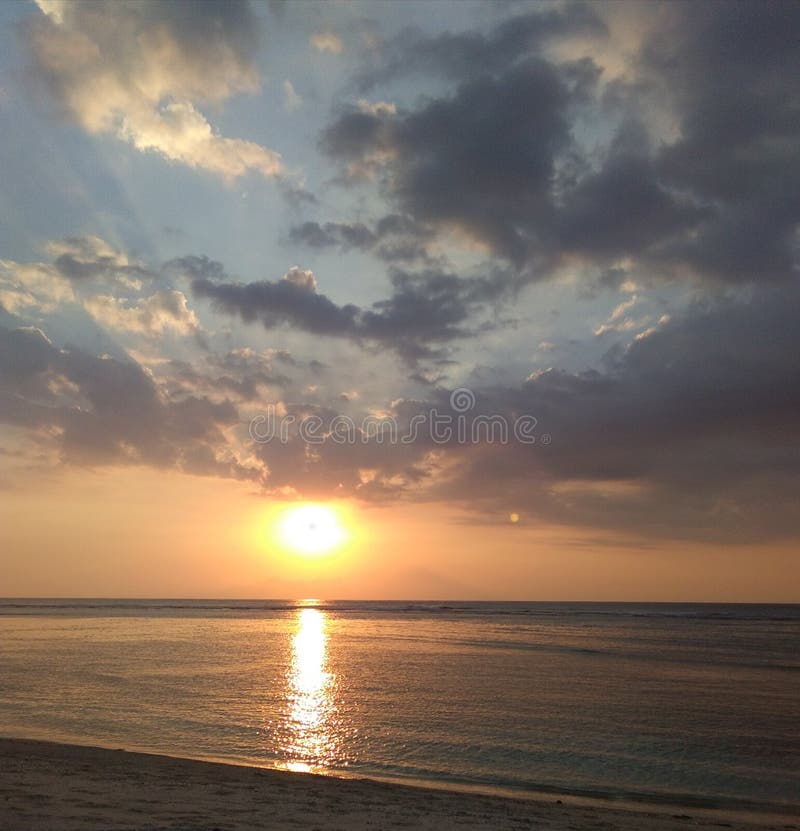 The Sun Sets on the Beach, a Sign that Night Will Come Soon Stock Photo ...