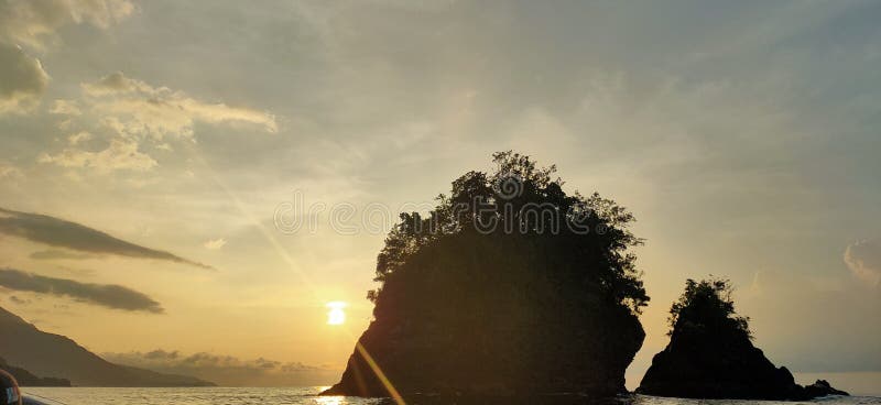 The Sun Sets Behind the Island Stock Photo - Image of cape, papua ...