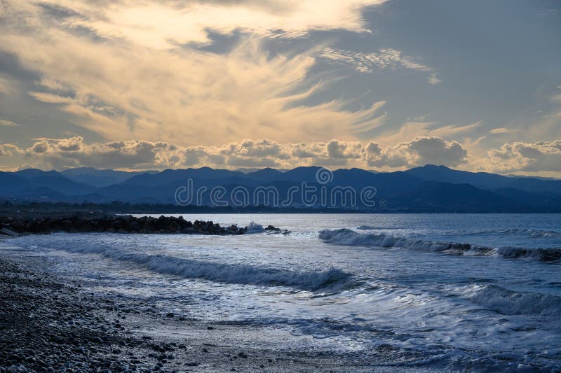 The Sun Sets Behind a Mountain on the Mediterranean Coast 1 Stock Photo ...