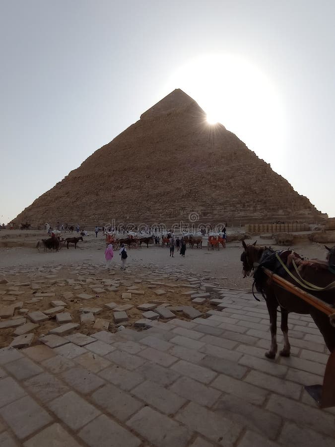 The Sun Sets Behind the Pyramid Stock Photo - Image of sand, pyramid ...