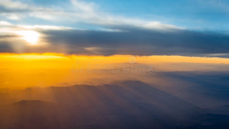 Sunset of a Cloudy Sky Seen from an Airplane Mid Flight Stock Photo ...