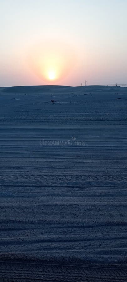 The sun sets in the desert stock photo. Image of winter - 316848276