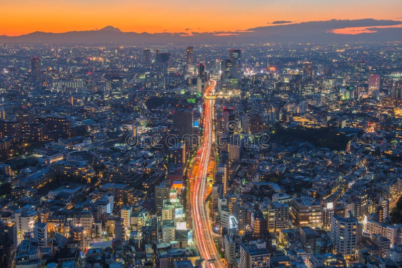 The Sun Sets Over the Cityscape of Tokyo Stock Photo - Image of lights ...