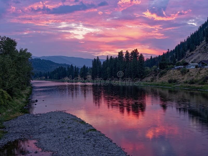 The Sun Sets Over the Clark Fork River in the Town of Superior, Montana ...